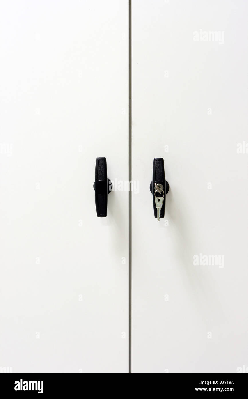 white metallic closet detail black handles with keys vertical Stock ...