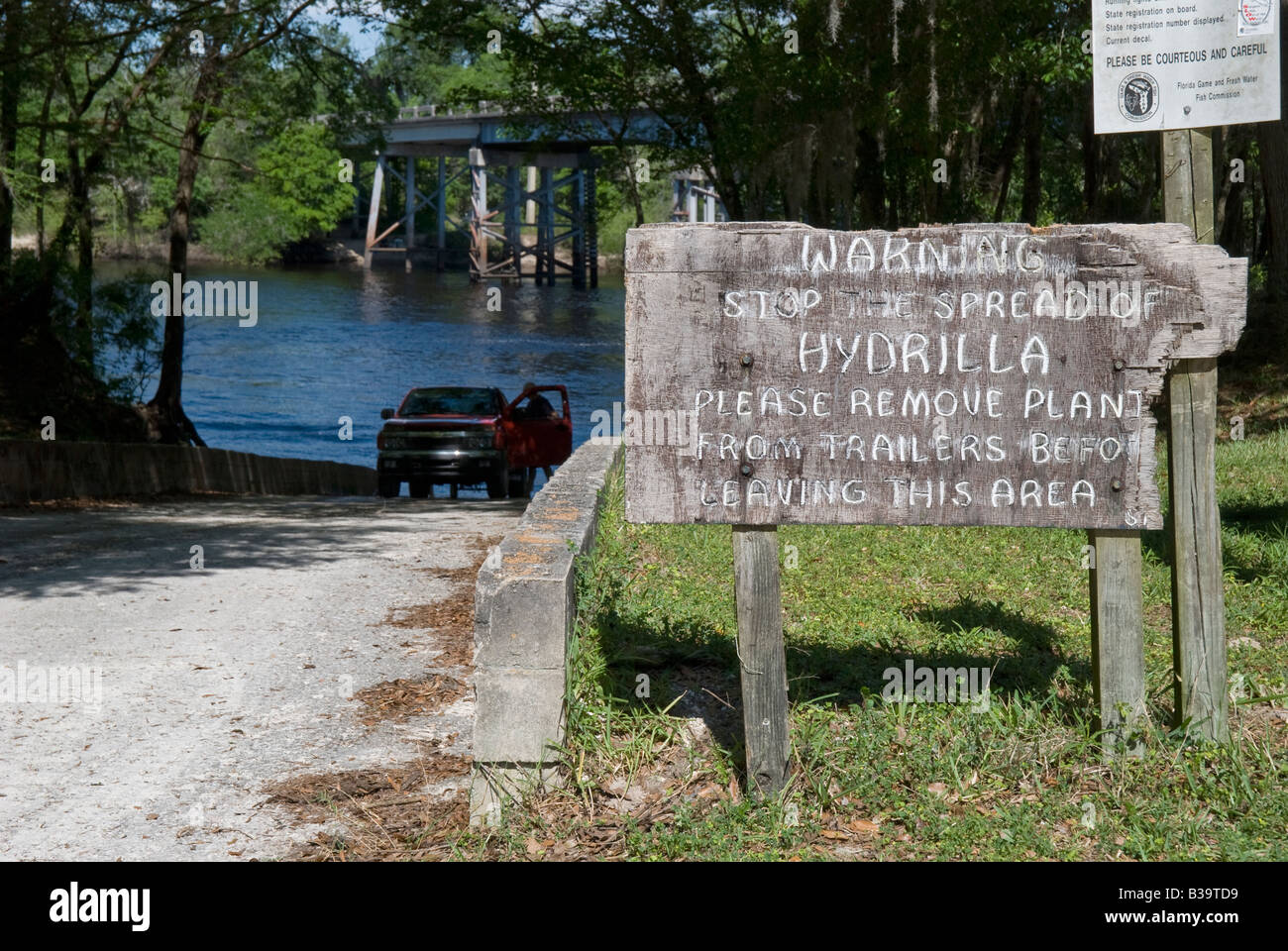 Sign to remove harmful invasive plant called hydrilla from boat ...