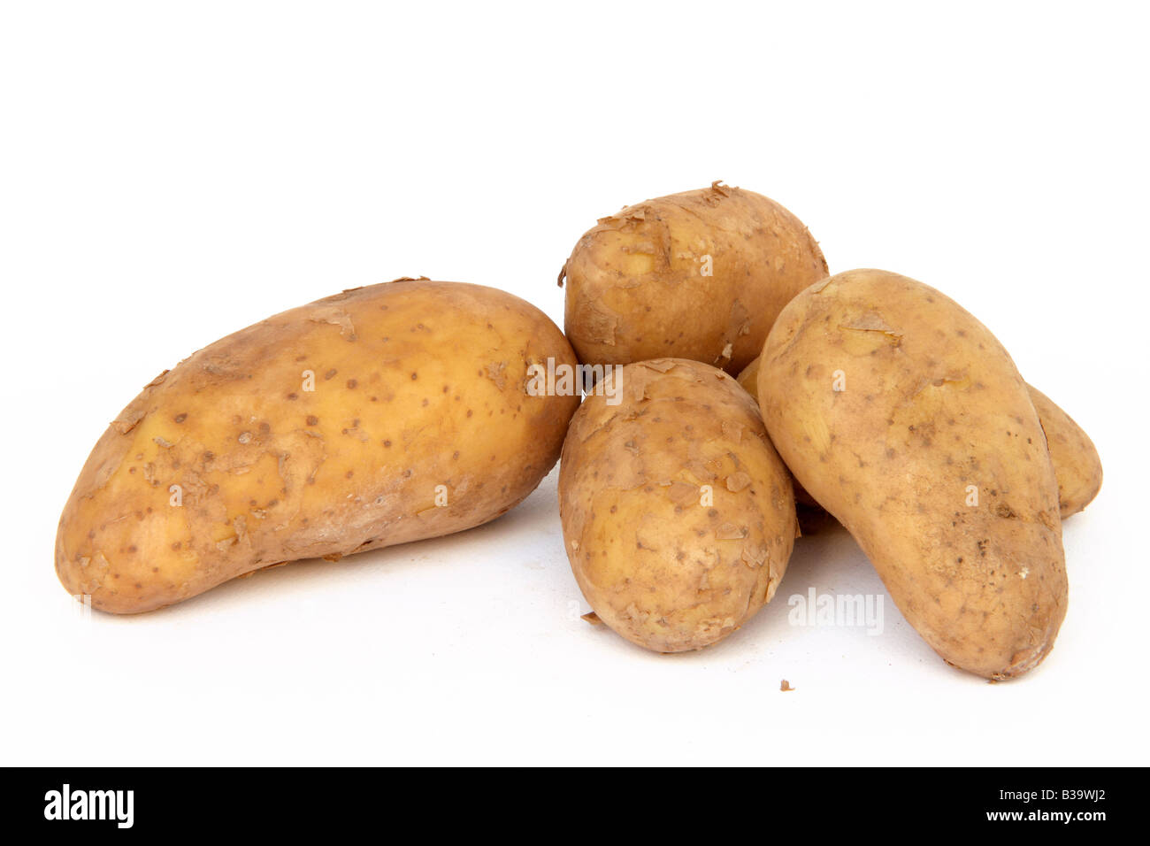 heap raw potatos vegetable root closeup isolated on white background ...