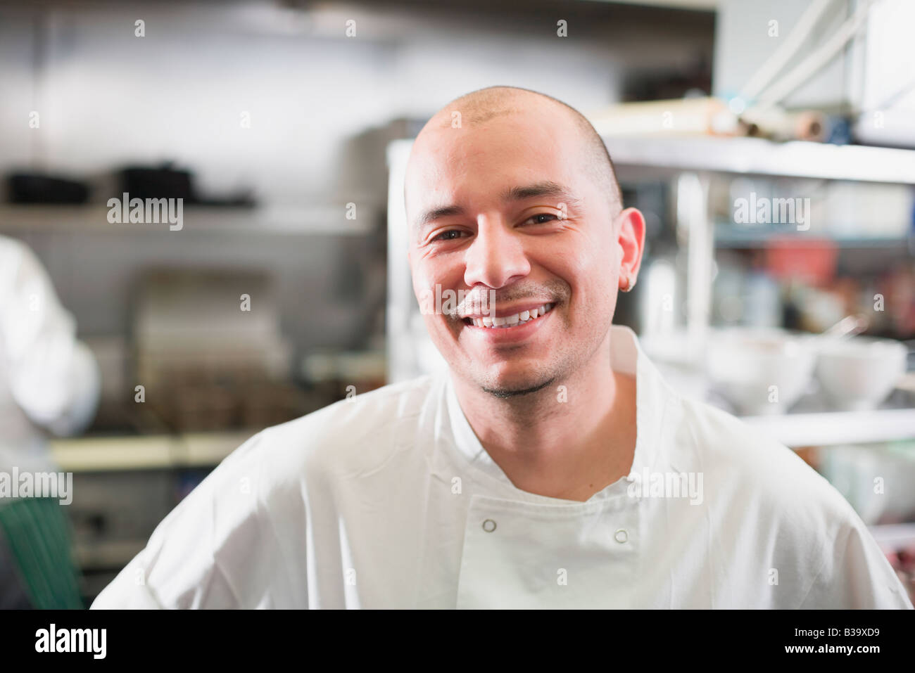 Hispanic male chef in kitchen Stock Photo - Alamy