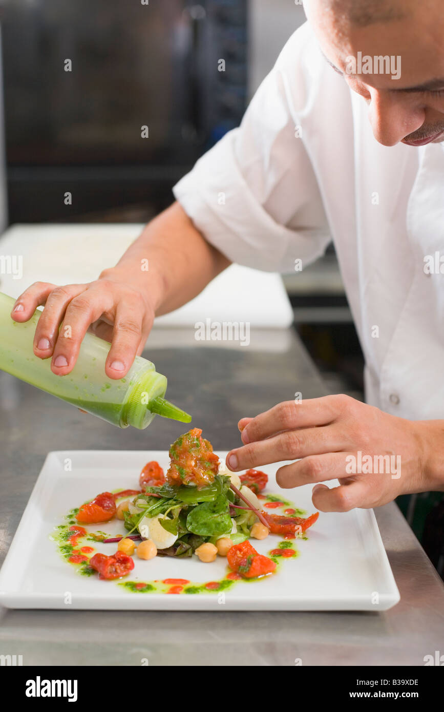 Hispanic male chef preparing food Stock Photo - Alamy