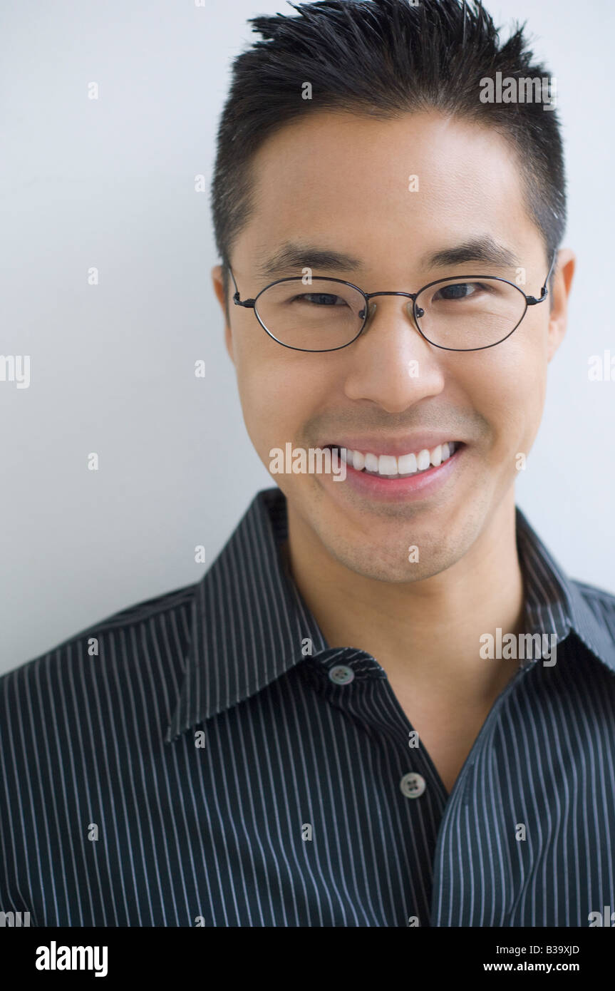 Asian man wearing eyeglasses Stock Photo - Alamy