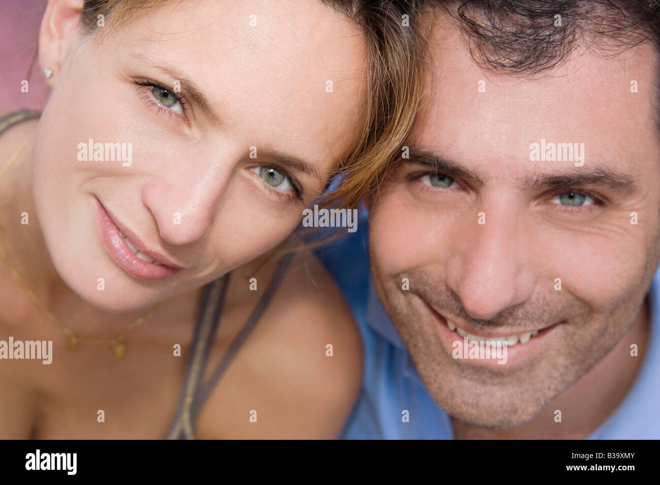Hispanic couple touching heads Stock Photo - Alamy