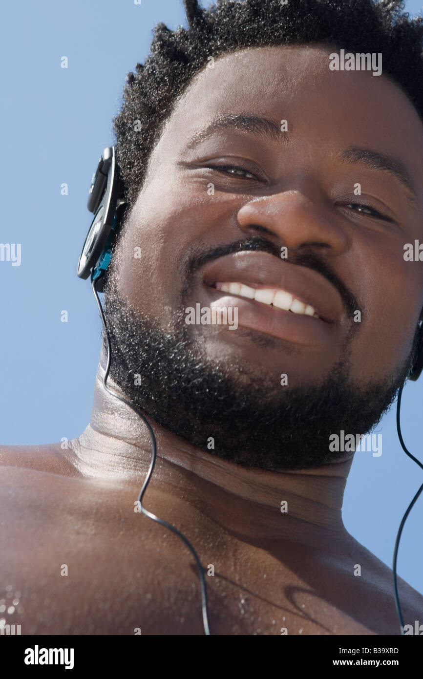 African man listening to headphones Stock Photo - Alamy