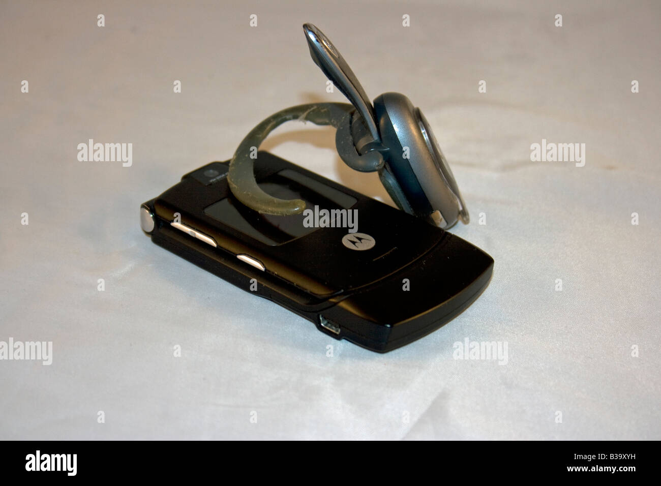 Silo Cell Phone and Bluetooth Ear Piece Stock Photo - Alamy