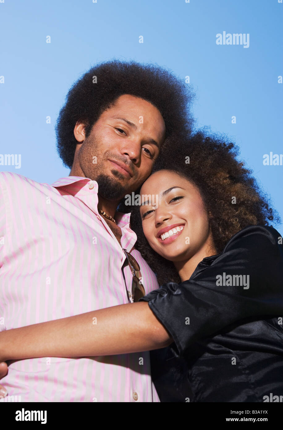 African couple hugging Stock Photo - Alamy