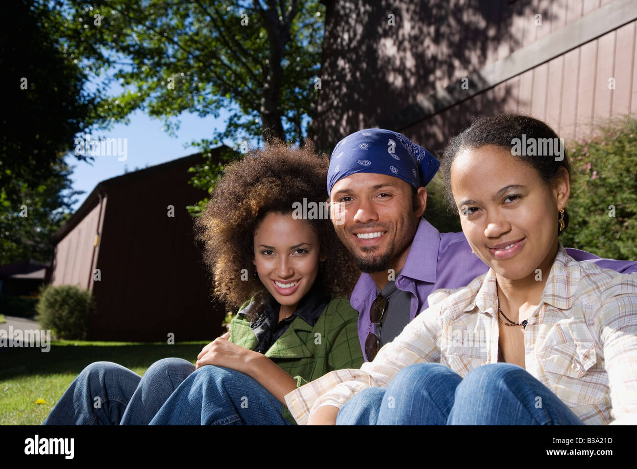 African friends hugging outdoors Stock Photo - Alamy