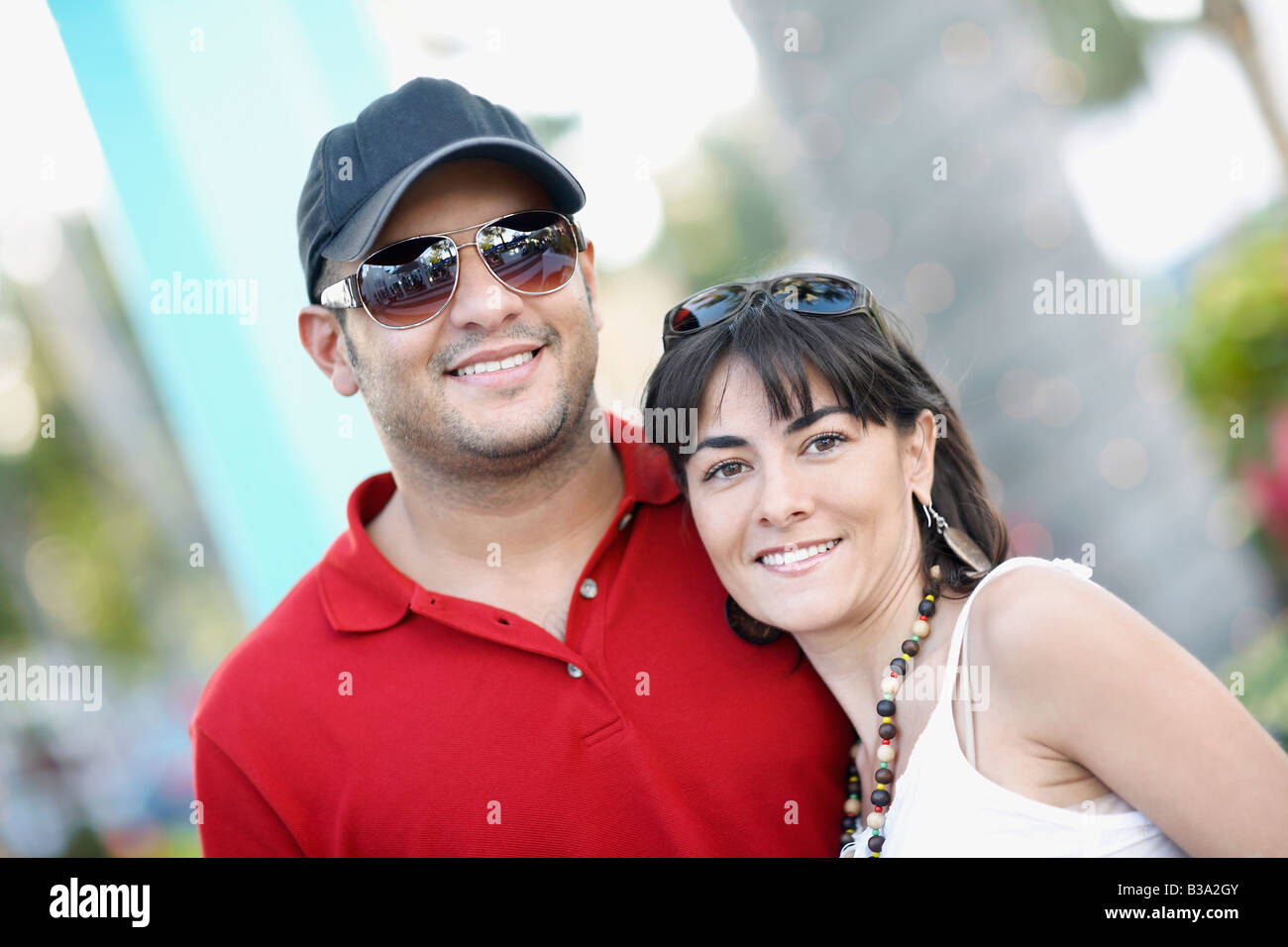Hispanic couple hugging Stock Photo - Alamy