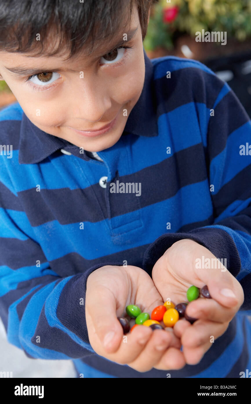 Handful of candy hi-res stock photography and images - Alamy