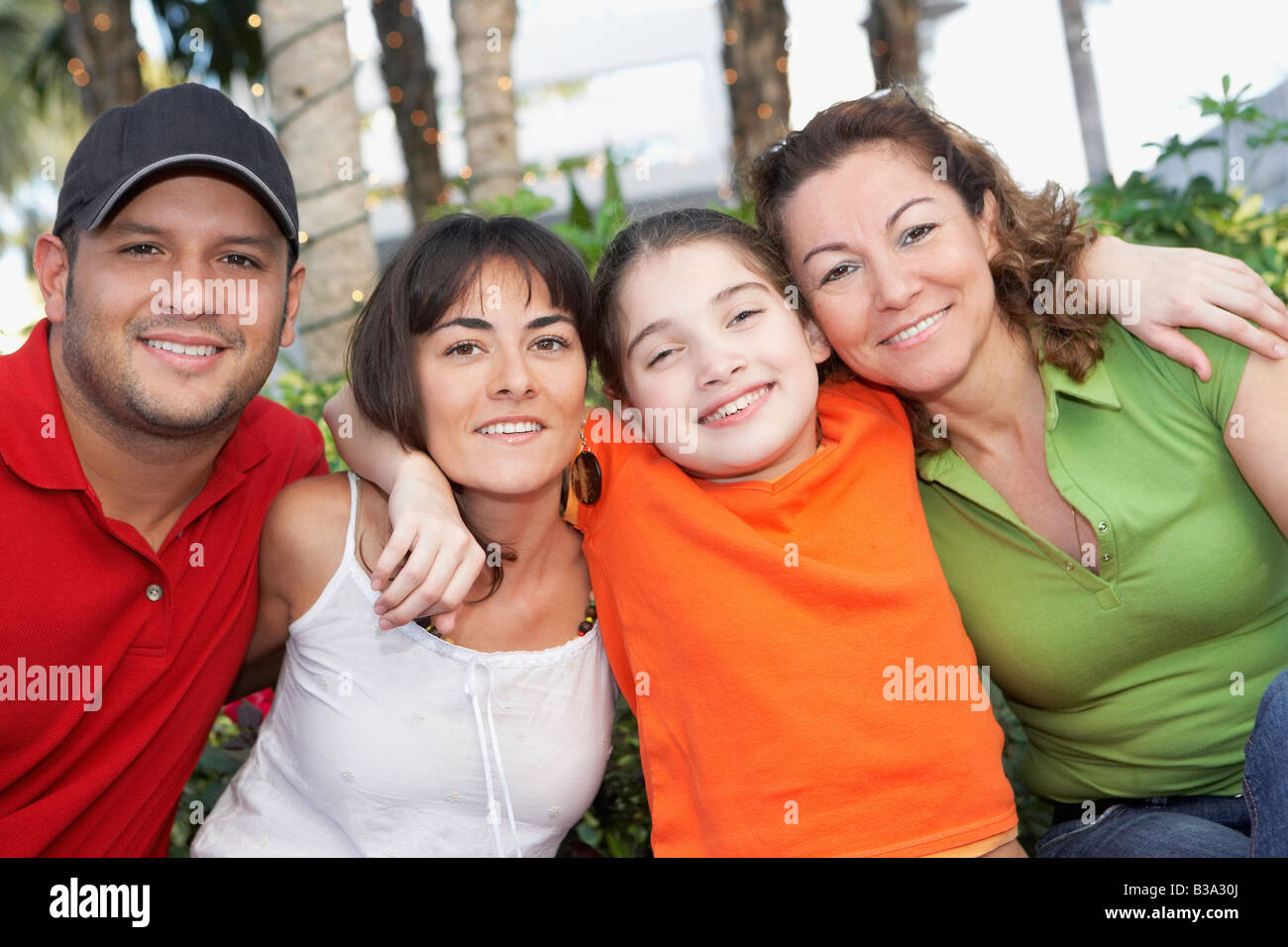 Hispanic family hugging Stock Photo - Alamy