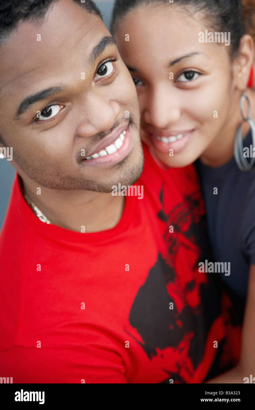 Young African couple hugging Stock Photo - Alamy