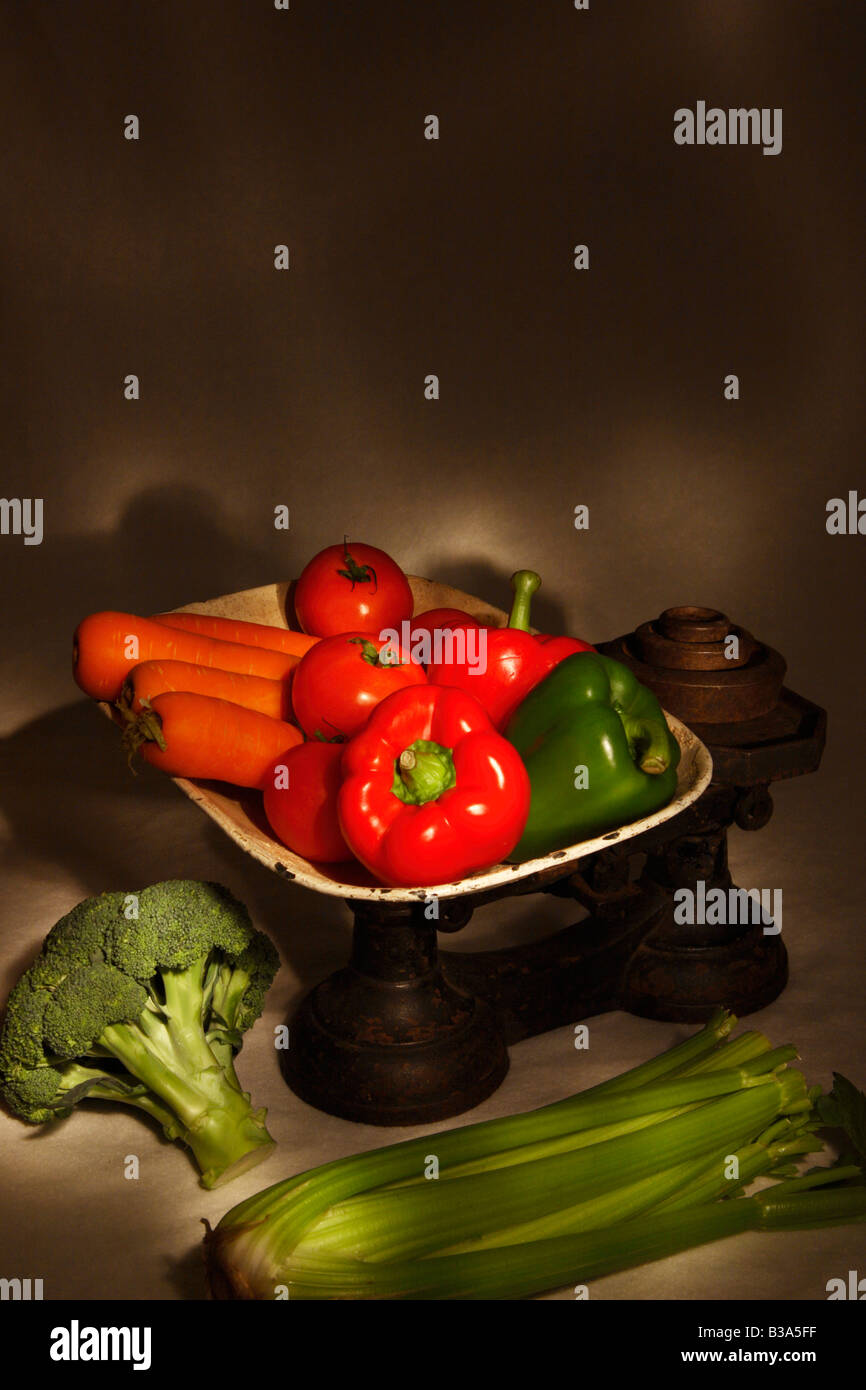 Mixed vegetables on old antique scales Stock Photo - Alamy