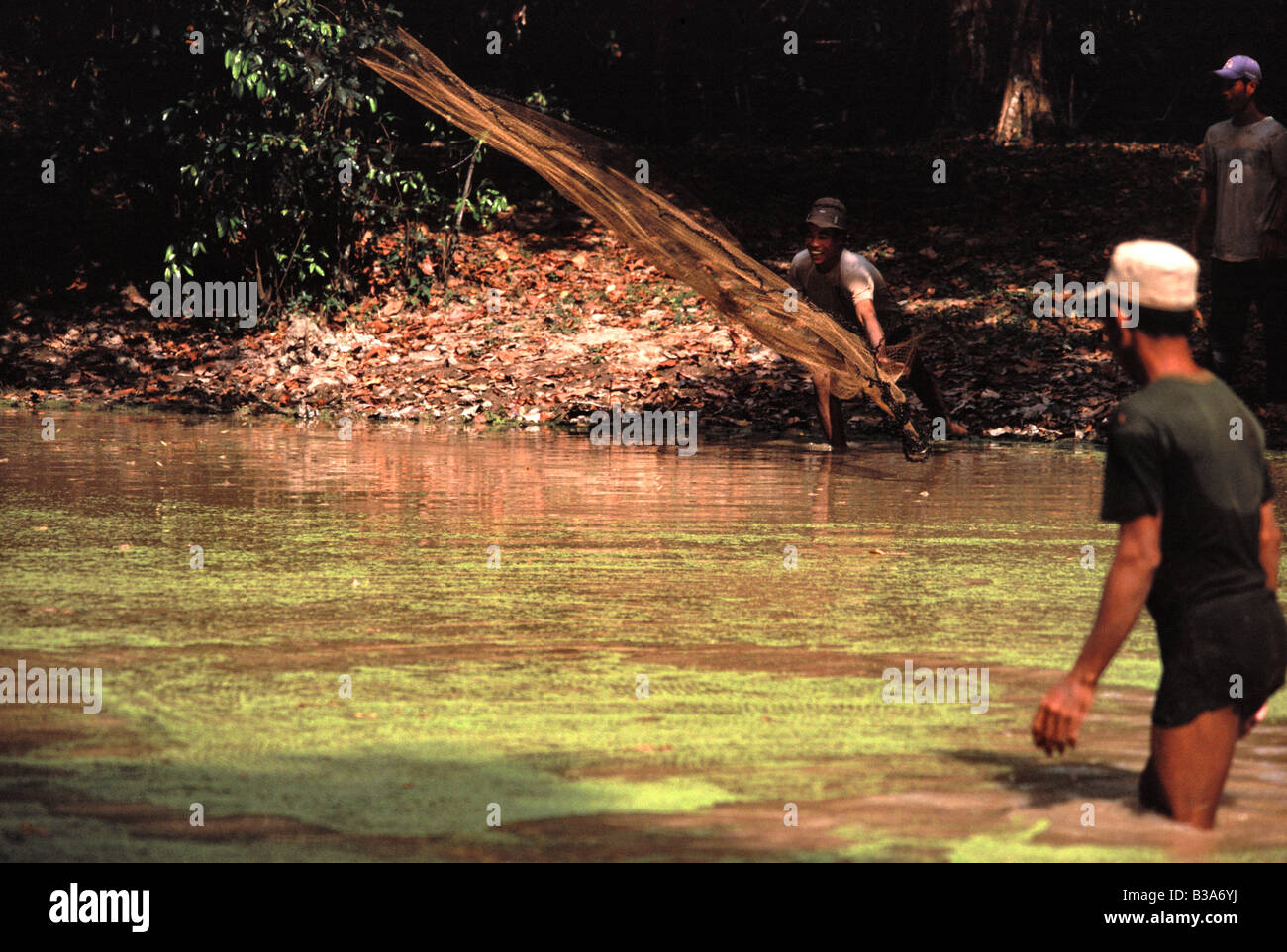 Men casting fishing nets hi-res stock photography and images - Alamy