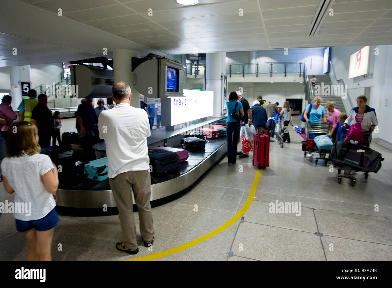 Waiting for luggage at luggage carousel Arrivals Manchester ...