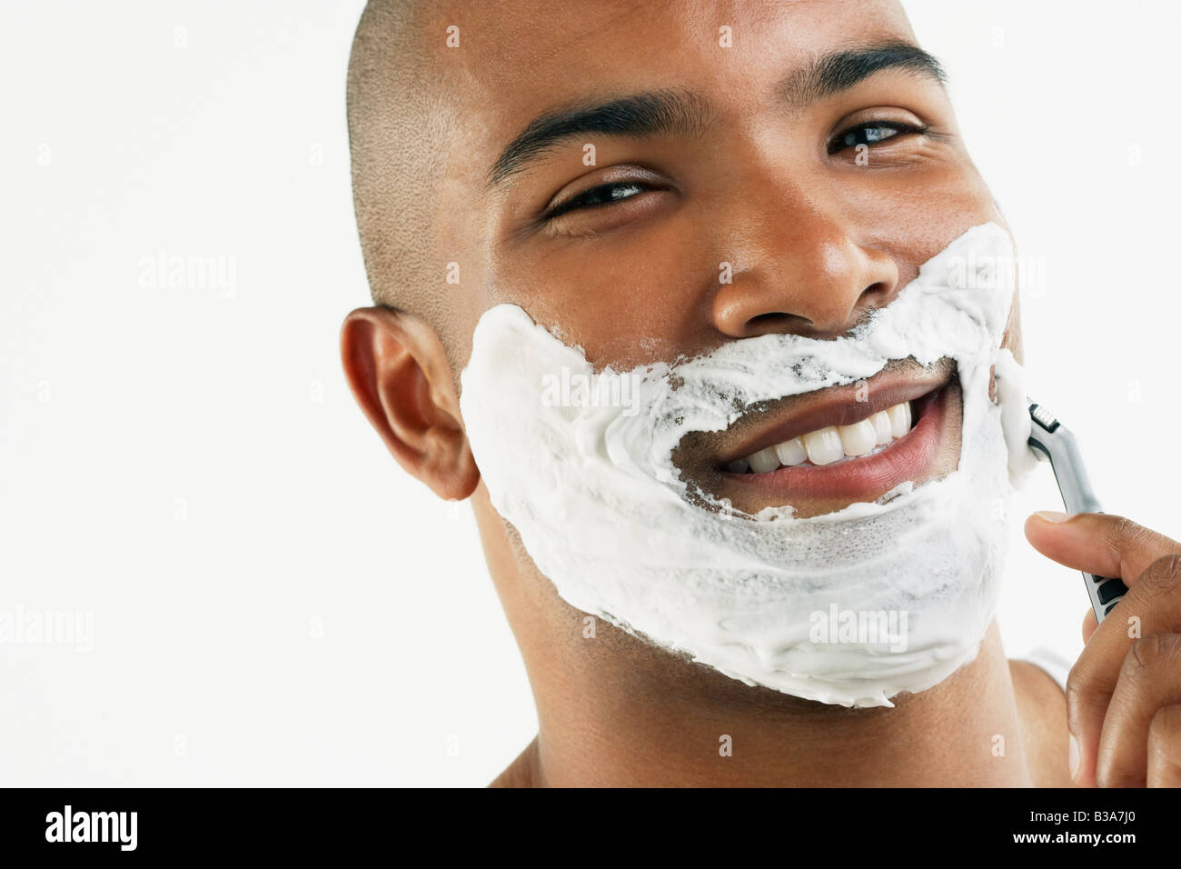 African man shaving face Stock Photo - Alamy