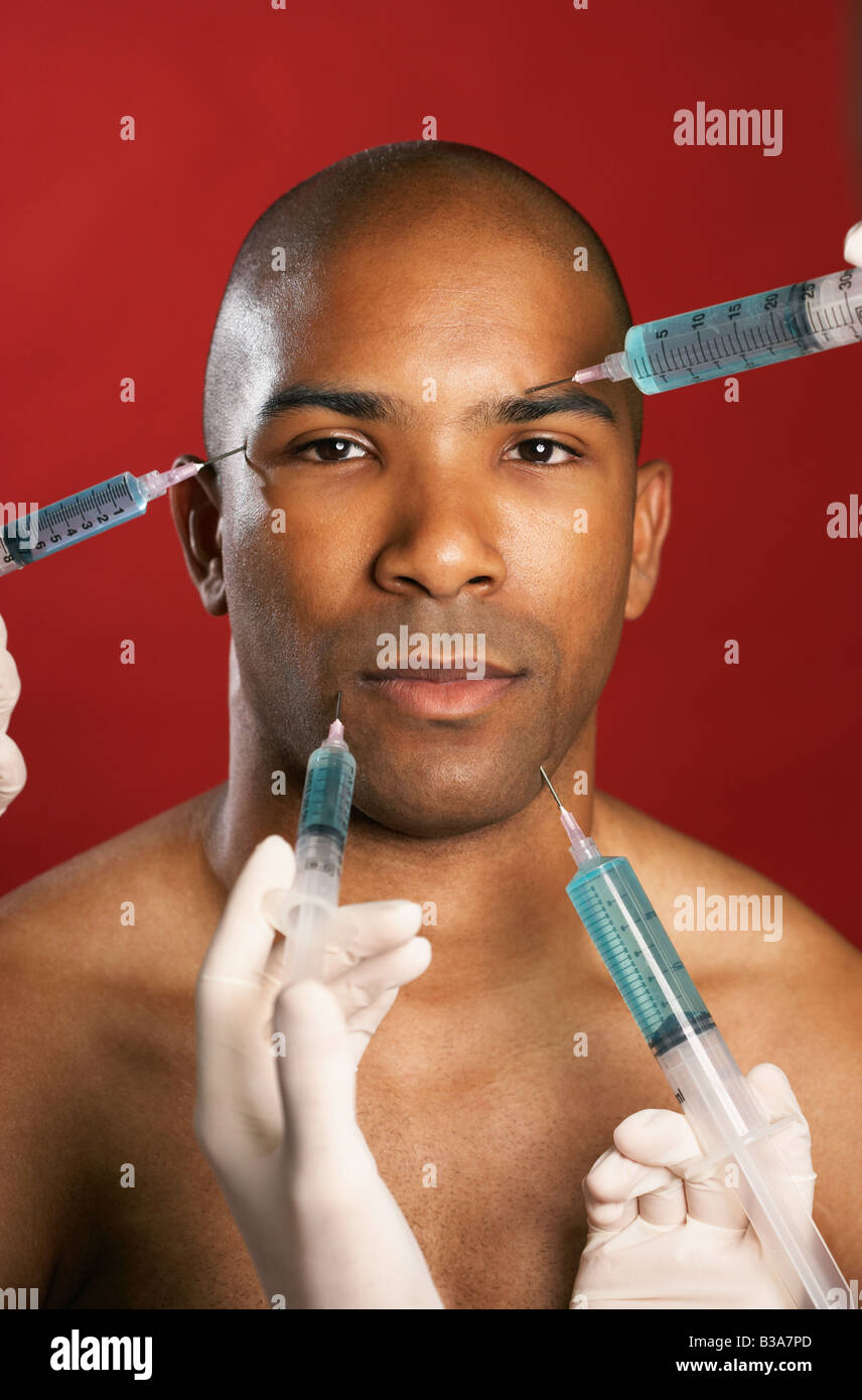 African American man receiving injections in face Stock Photo - Alamy