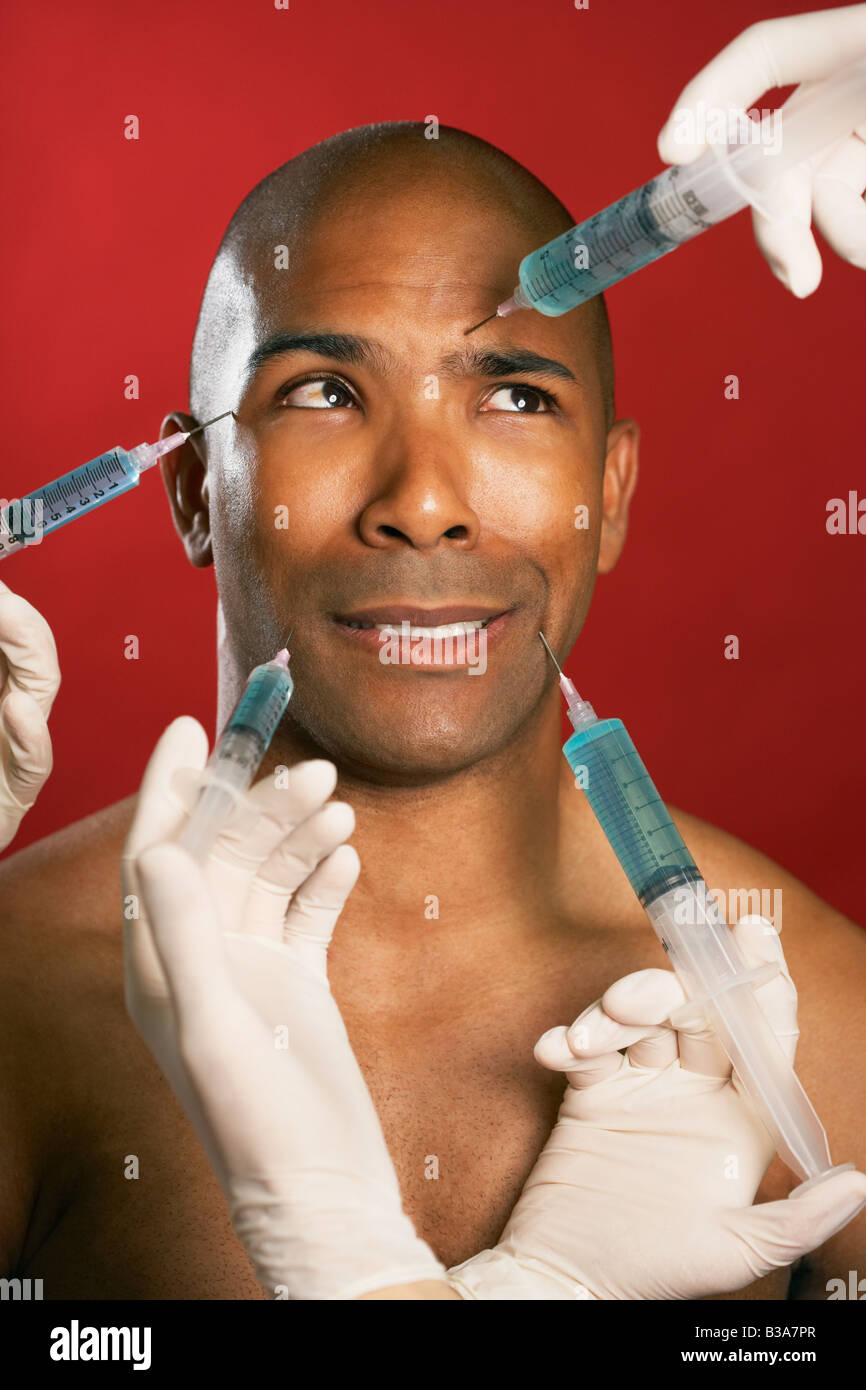 African American man receiving injections in face Stock Photo - Alamy