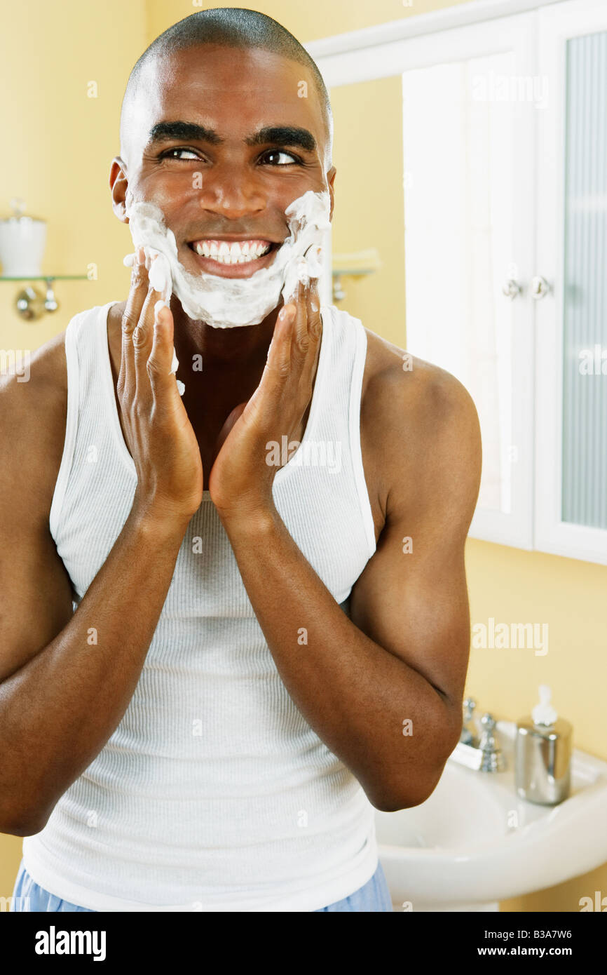African man applying shaving cream Stock Photo - Alamy