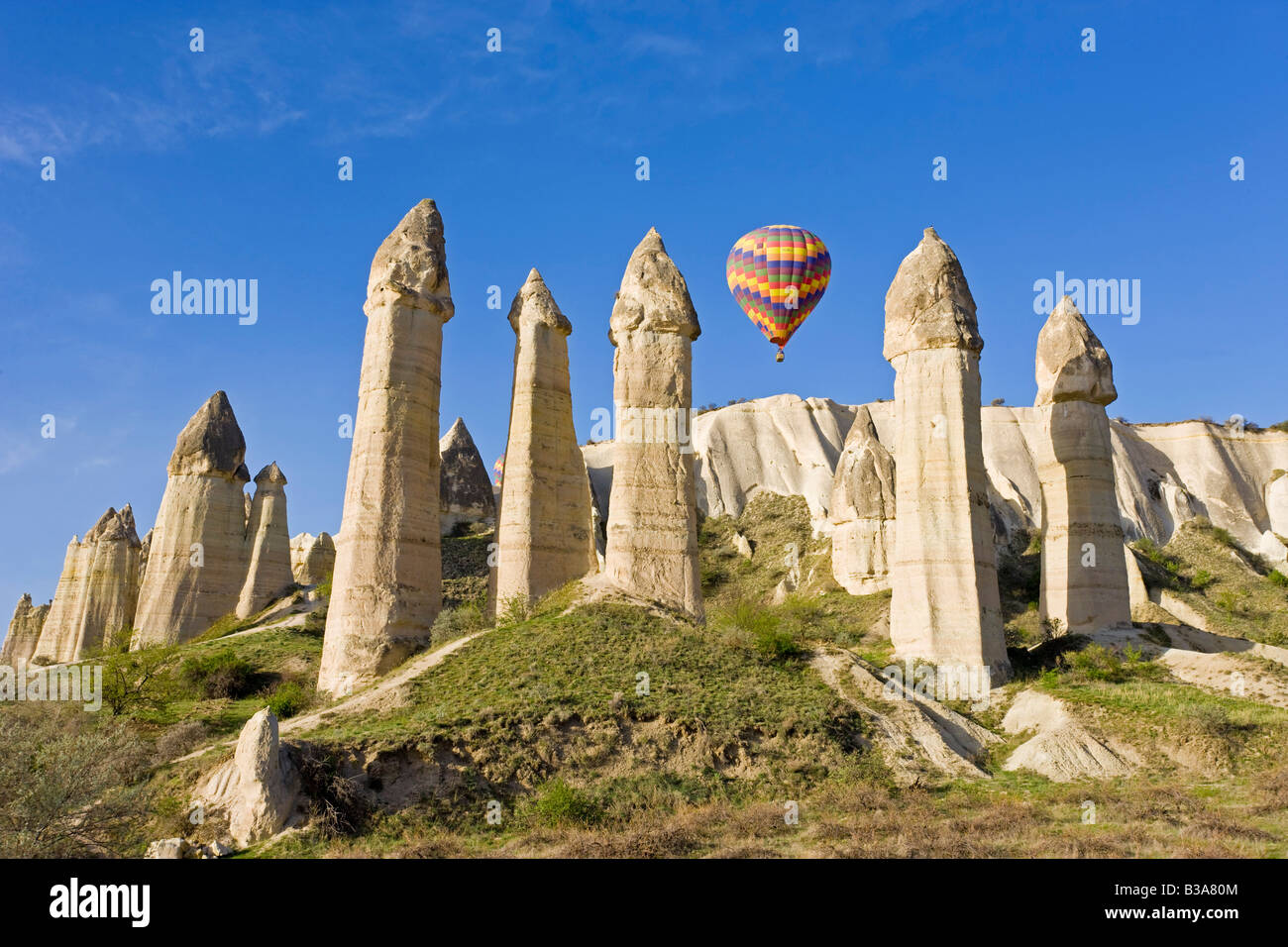 Hot Air balloon over Volcanic tufa rock pillars (Fairy Chimneys), Love ...