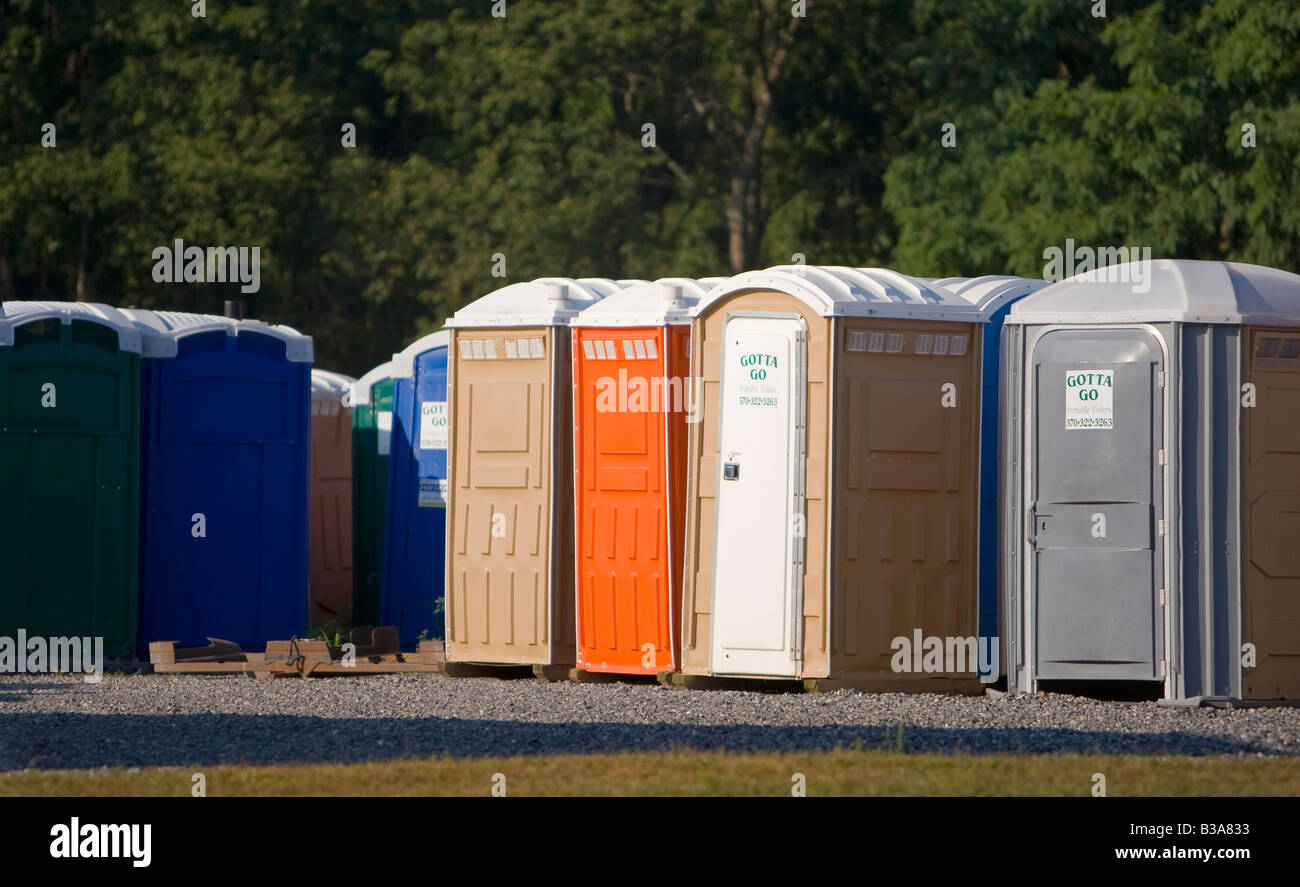 Row of portable toilets Stock Photo - Alamy