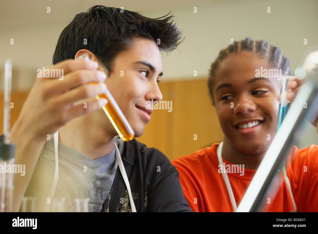 Multi-ethnic teenaged boys in science class Stock Photo - Alamy