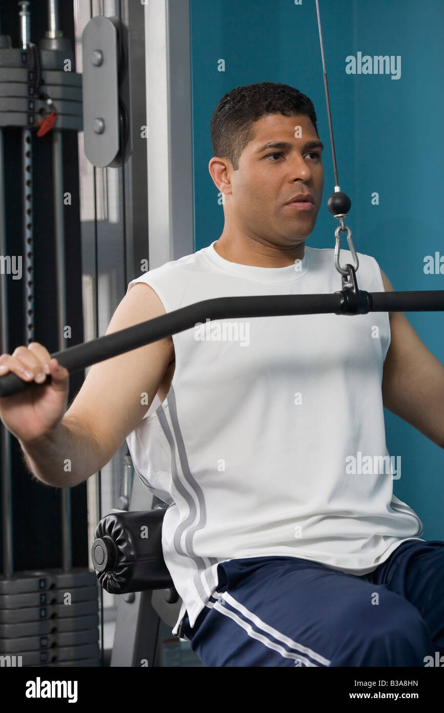 Man using weight machine hi-res stock photography and images - Alamy