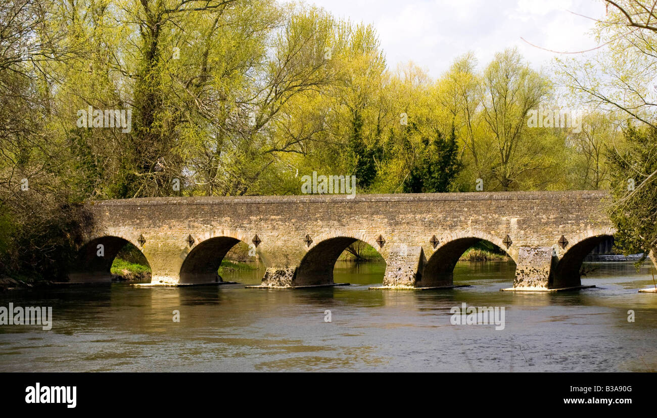 An stone arched bridge crossing the River Ouse at Oakley in ...