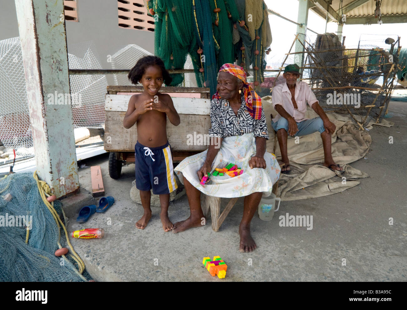 A caribbean child with his grandparents, the fishing village of Anse la ...