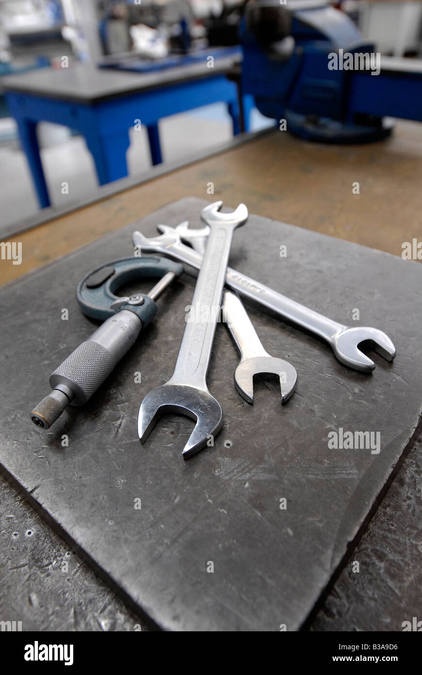 Spanners and micrometer on a bench in an engineering workshop Stock ...