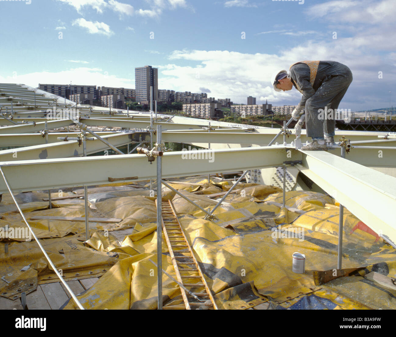 Man painting a bolted connection on a railway bridge, Newcastle upon ...
