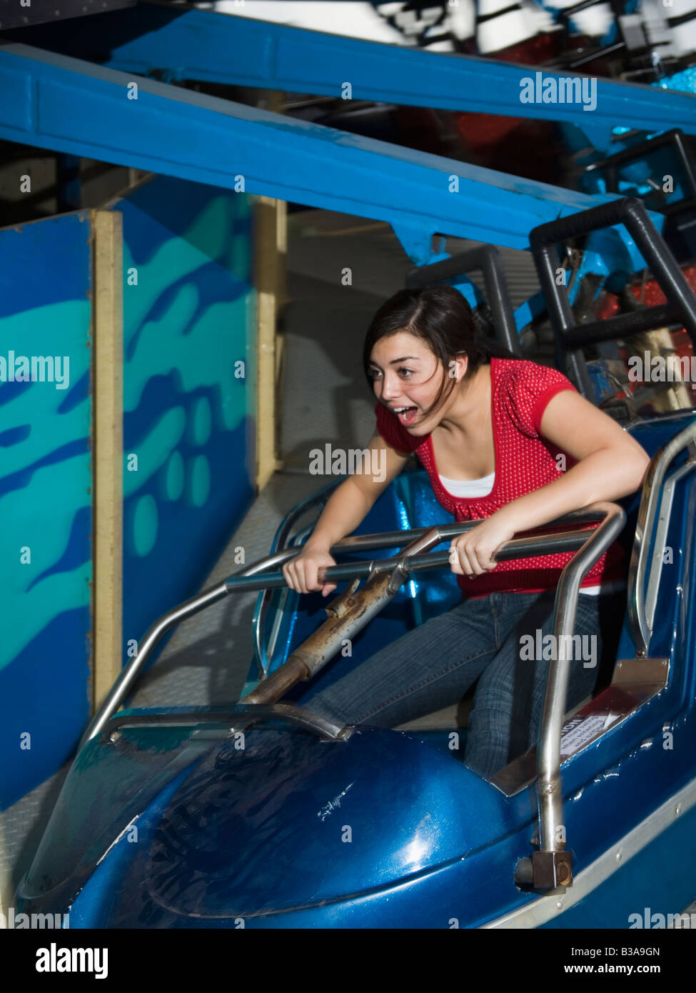 Mixed Race teenaged girl on carnival ride Stock Photo - Alamy