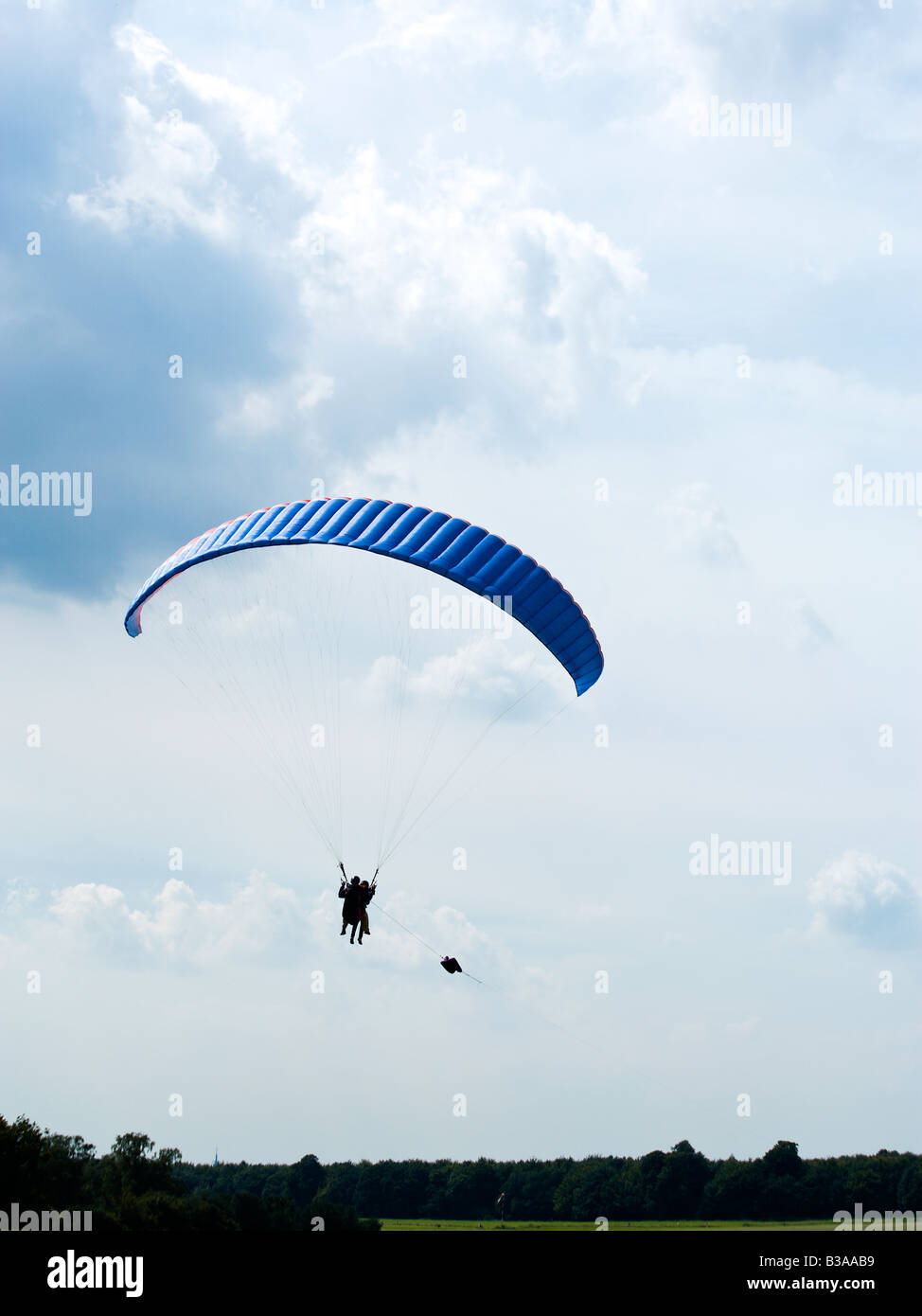 paraglider being lifted from the ground with a wire Stock Photo - Alamy