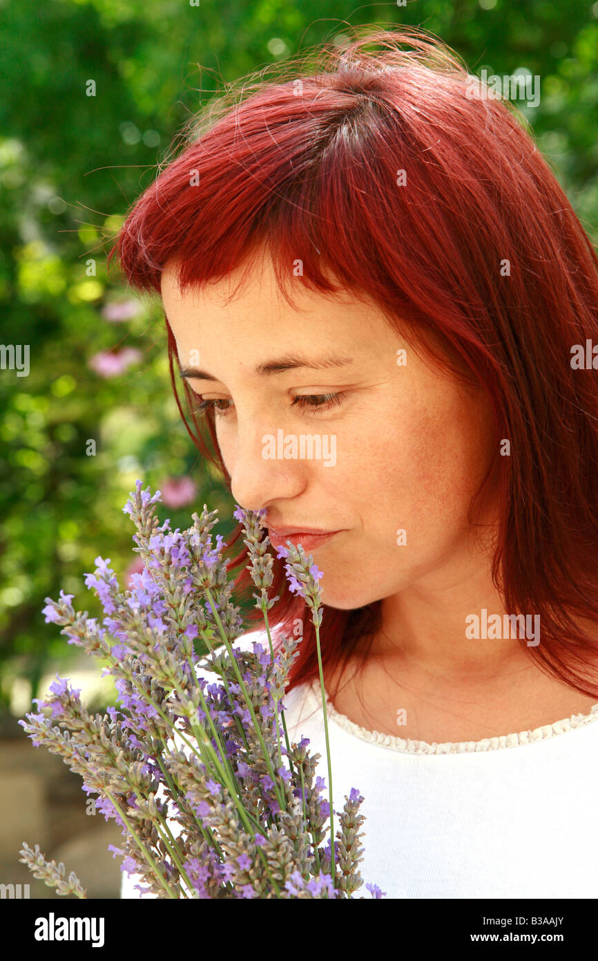 Lady smelling plants hi-res stock photography and images - Alamy