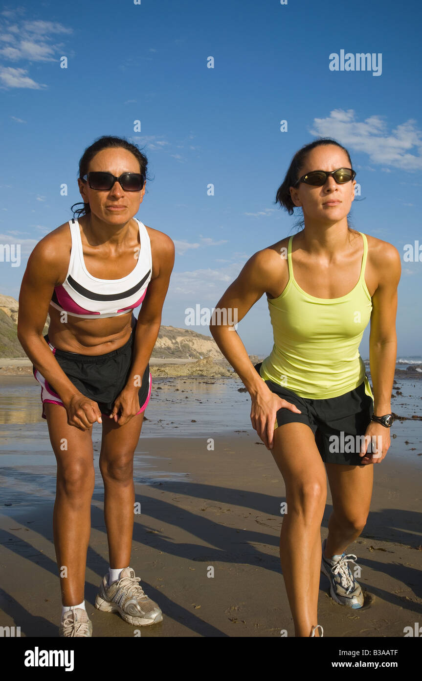 Hispanic female runners racing at beach Stock Photo - Alamy