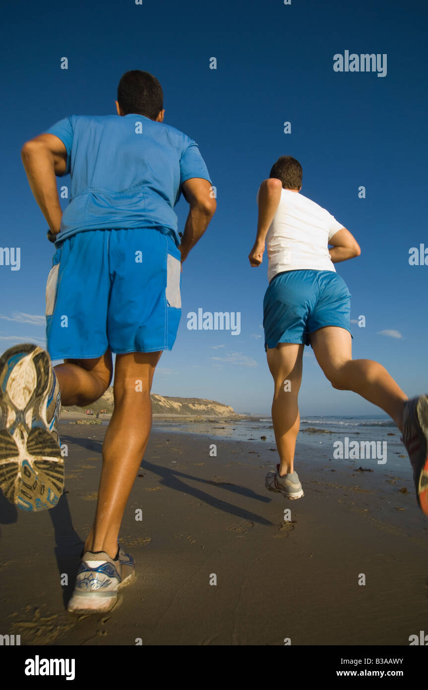 Rear view of three men running hi-res stock photography and images - Alamy