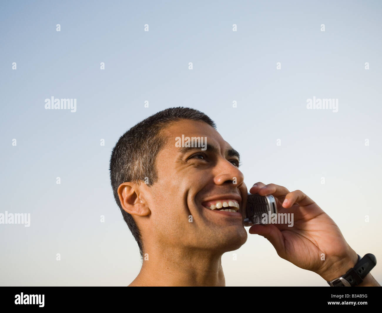 Hispanic man talking on cell phone Stock Photo - Alamy