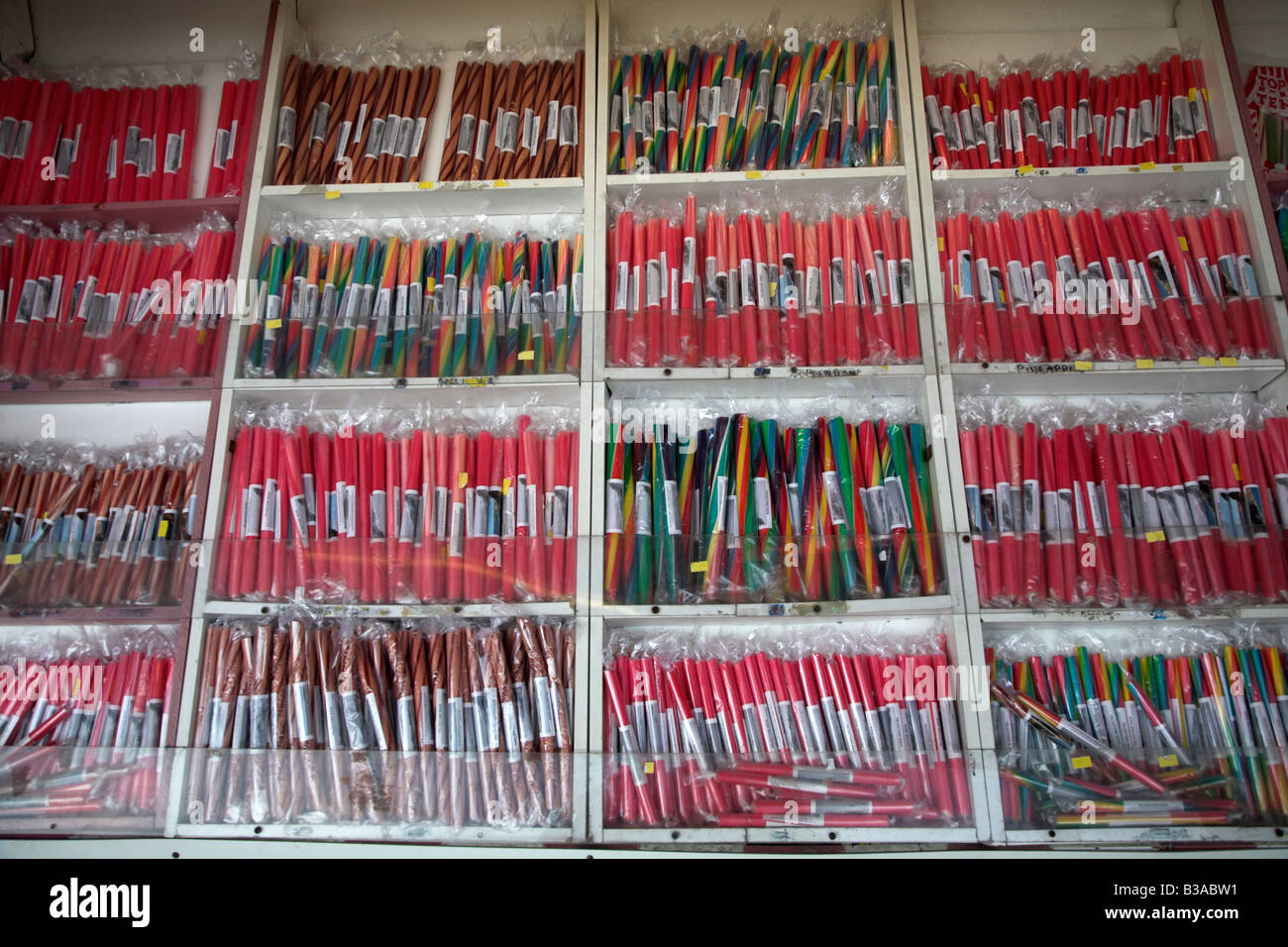 Sticks of traditional seaside rock sweets on display Stock Photo - Alamy