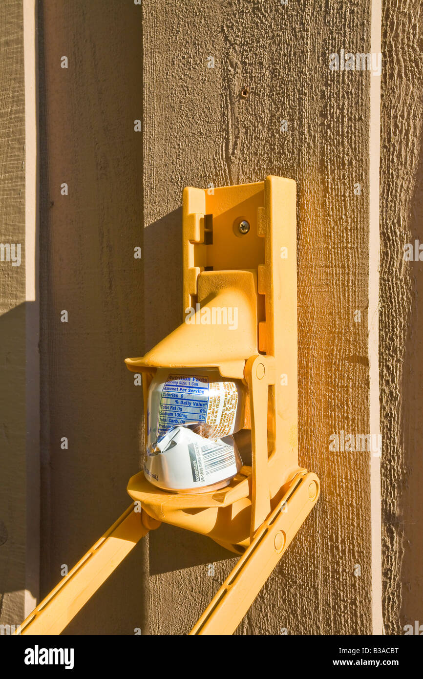 Inexpensive aluminum can crusher mounted on wall Stock Photo - Alamy