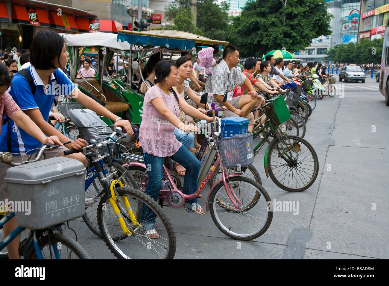 Cycles at rush hour at a busy cross roads intersection of Daye Road and ...