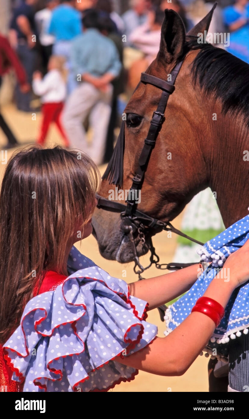 Jerez Horse Fair, Feria del Caballo, young woman with horse dressed in ...