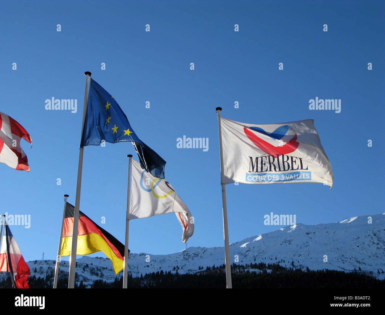 Flags fly in the ski resort of Meribel in the French Alps France Stock ...