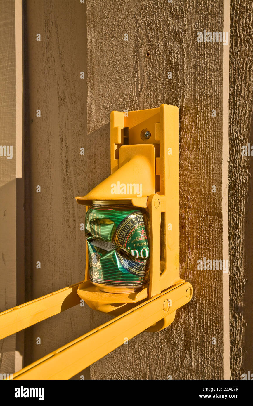 Inexpensive aluminum can crusher mounted on wall Stock Photo - Alamy