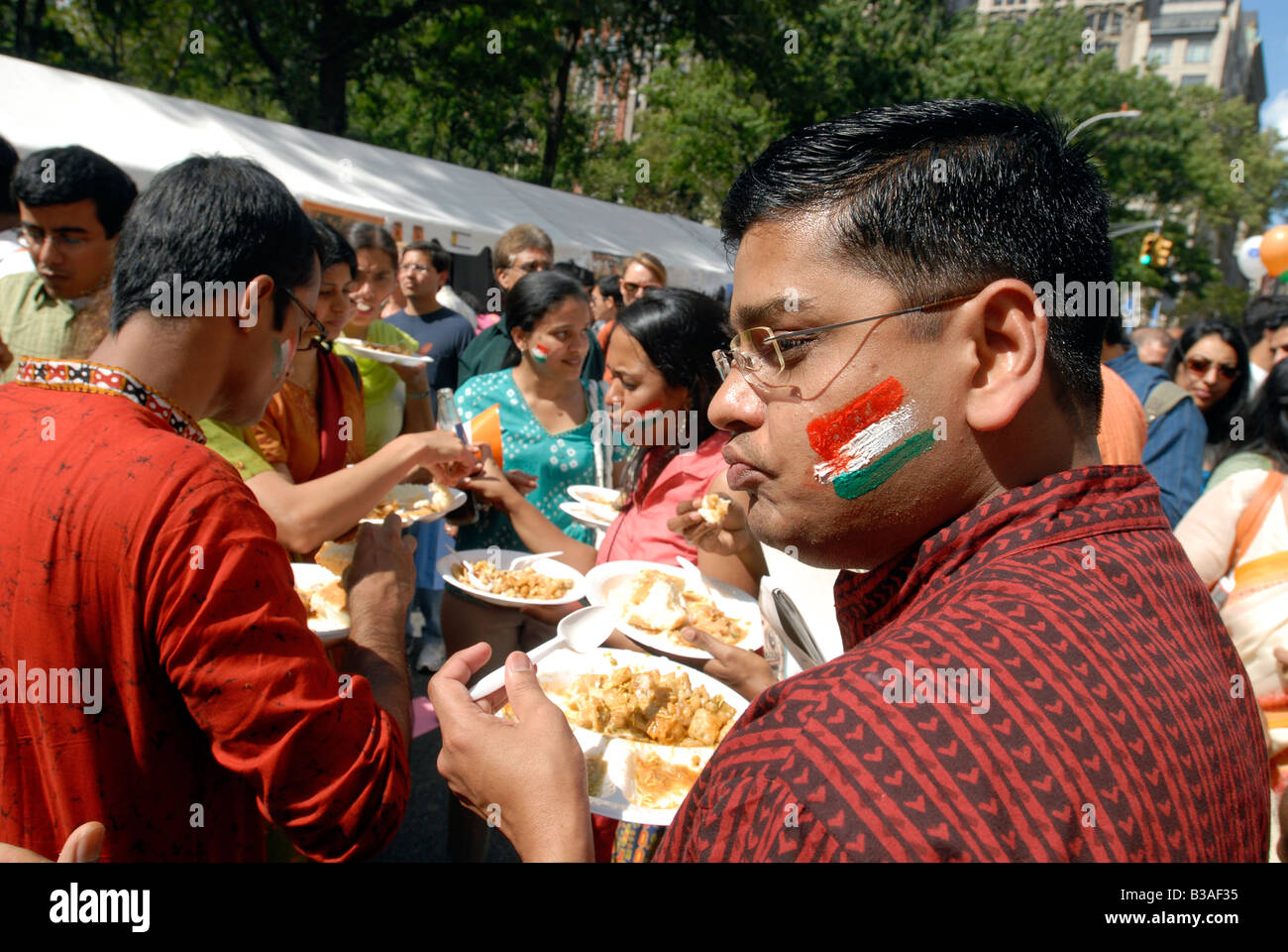 Parade goers are served authentic Indian food from the vendors at the ...