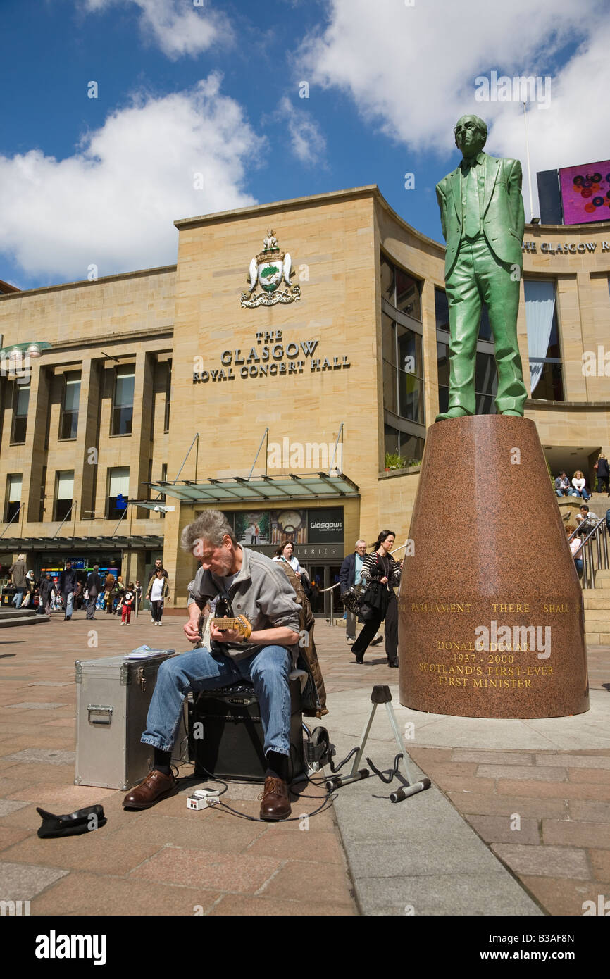 Busker in Buchanan Street Glasgow near the statue of Donald Dewar ...