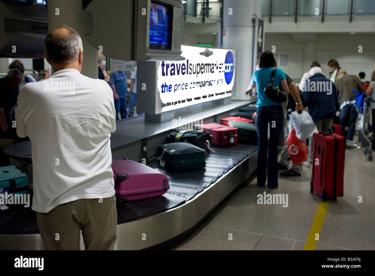 Waiting for luggage at luggage carousel Arrivals Manchester ...
