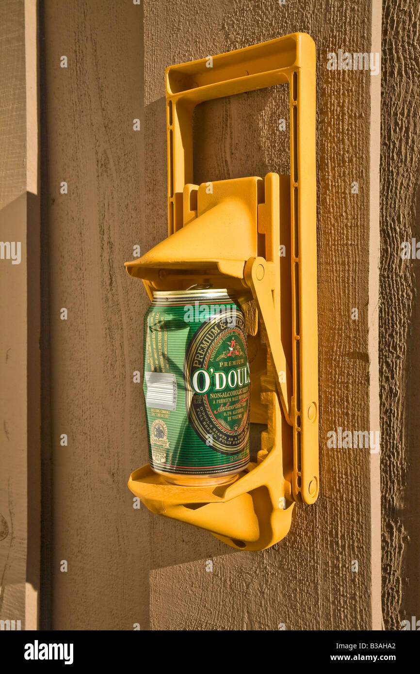 Inexpensive aluminum can crusher mounted on wall Stock Photo - Alamy