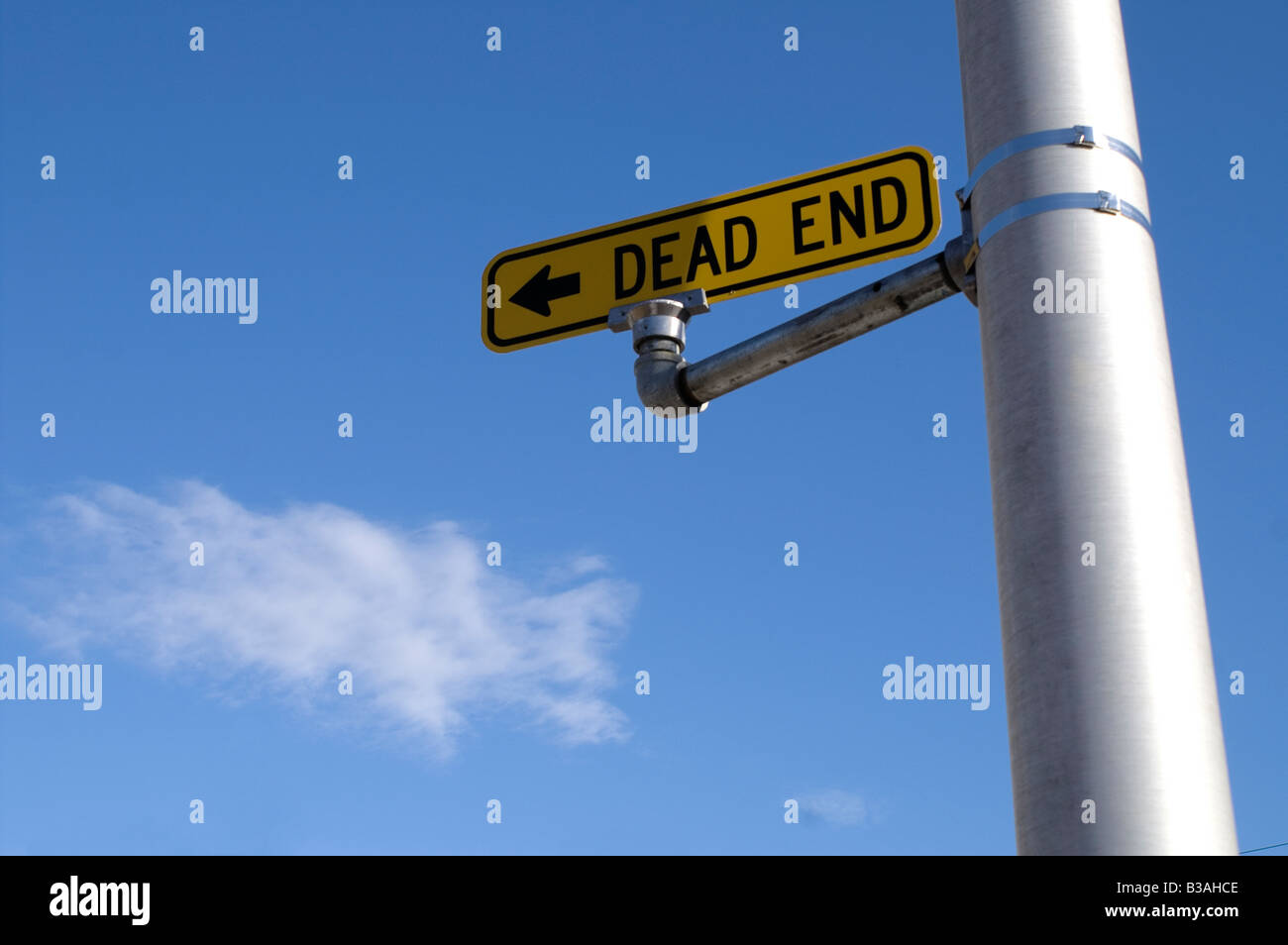 Yellow Dead End Street Sign on long Light Pole with Clear Blue Sky high ...