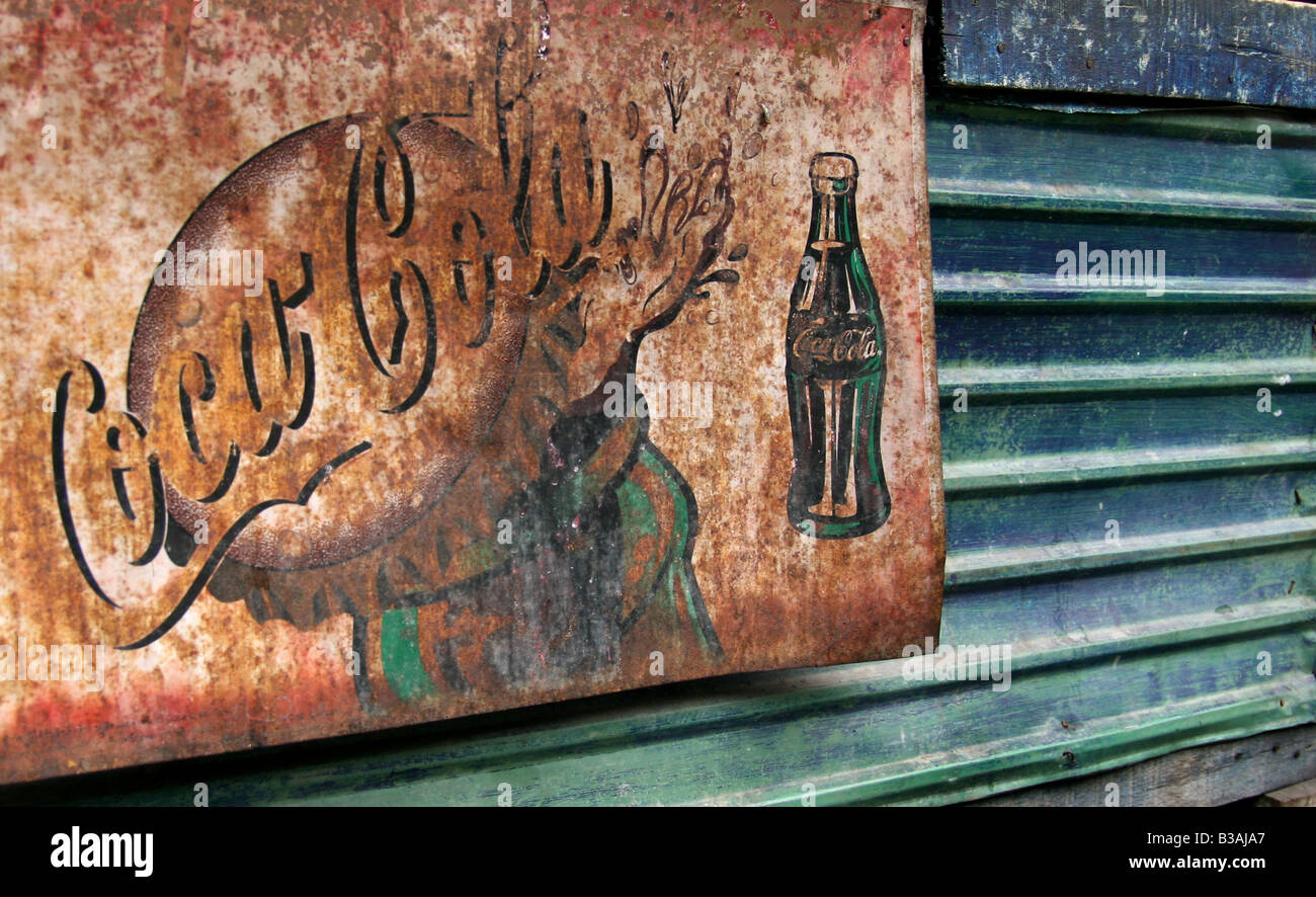 "Old decaying rusty coca cola Advertising sign Stock Photo - Alamy