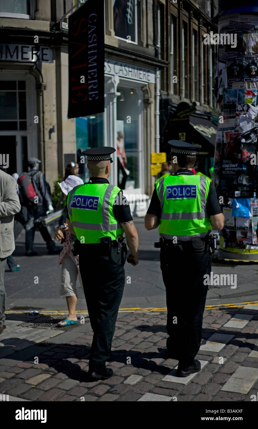 Two male Police officers patrol streets, Royal Mile, Edinburgh ...