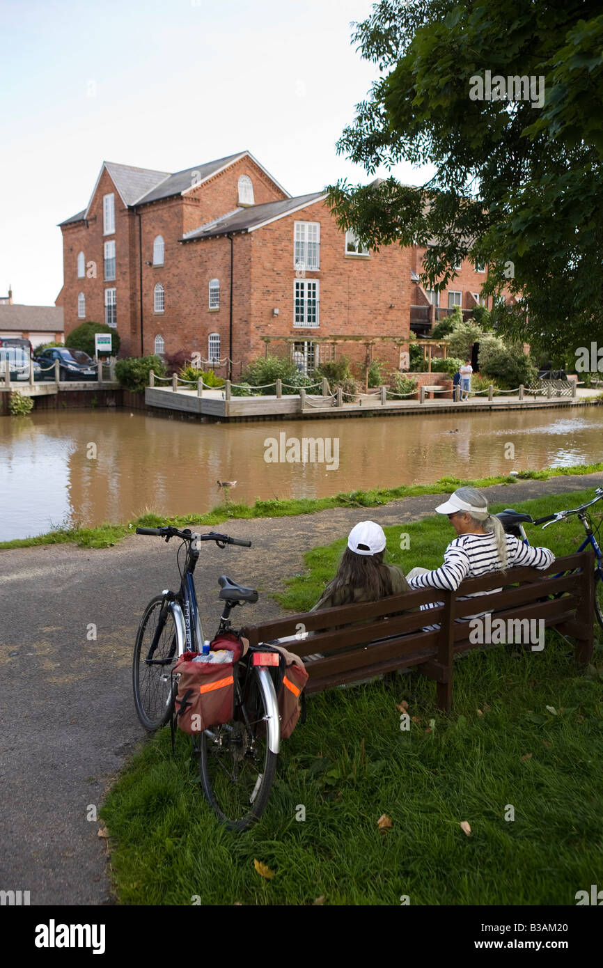 UK Cheshire Waverton Cyclists resting at Mill Quays beside Shropshire ...